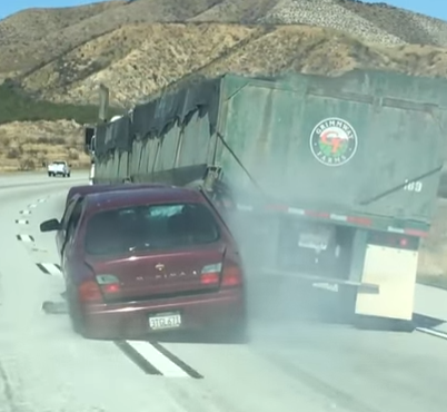 Blindspot or negligence: Car dragged by truck